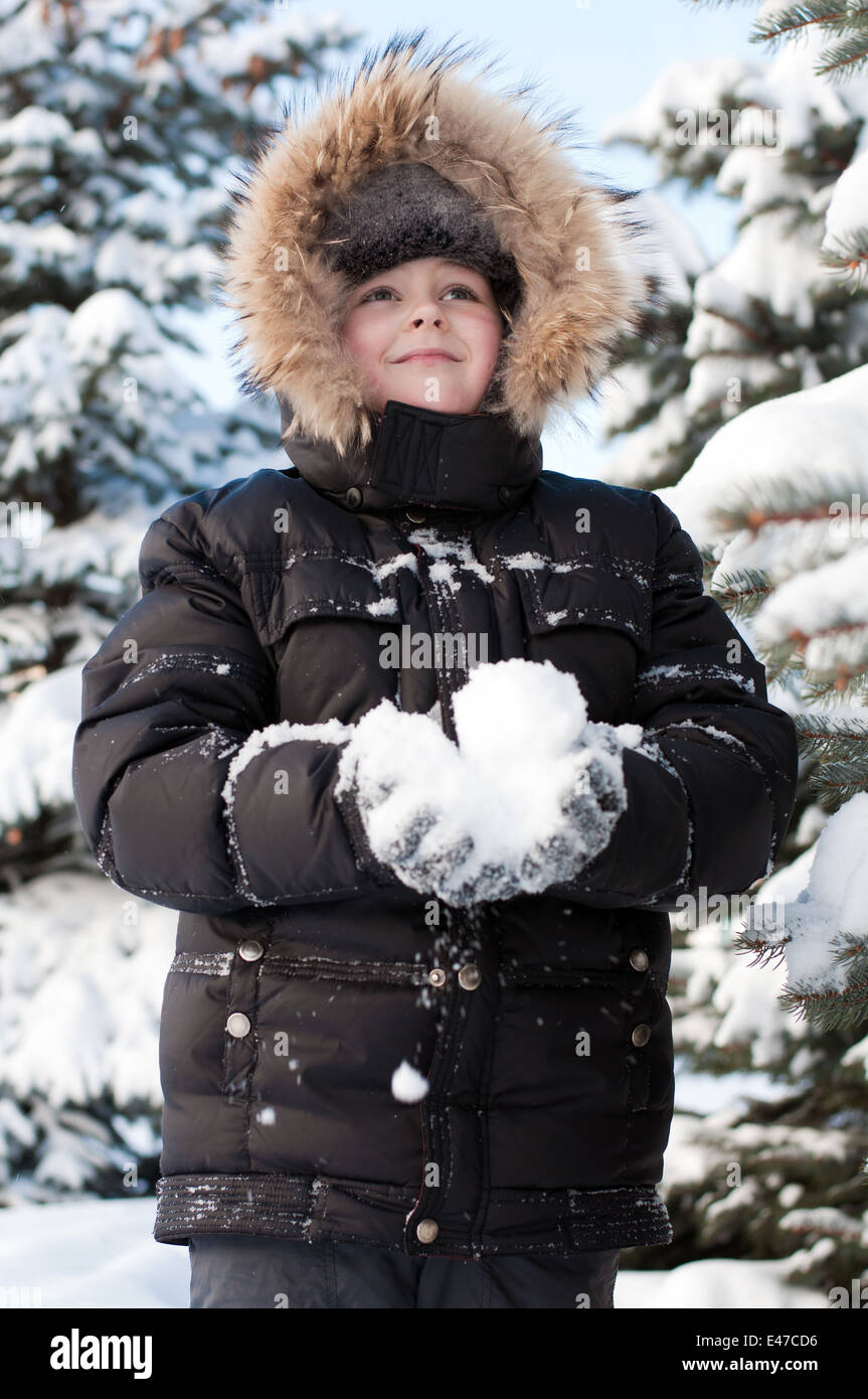 boy child one winter holiday Russia north cold jacket forest park snow ...