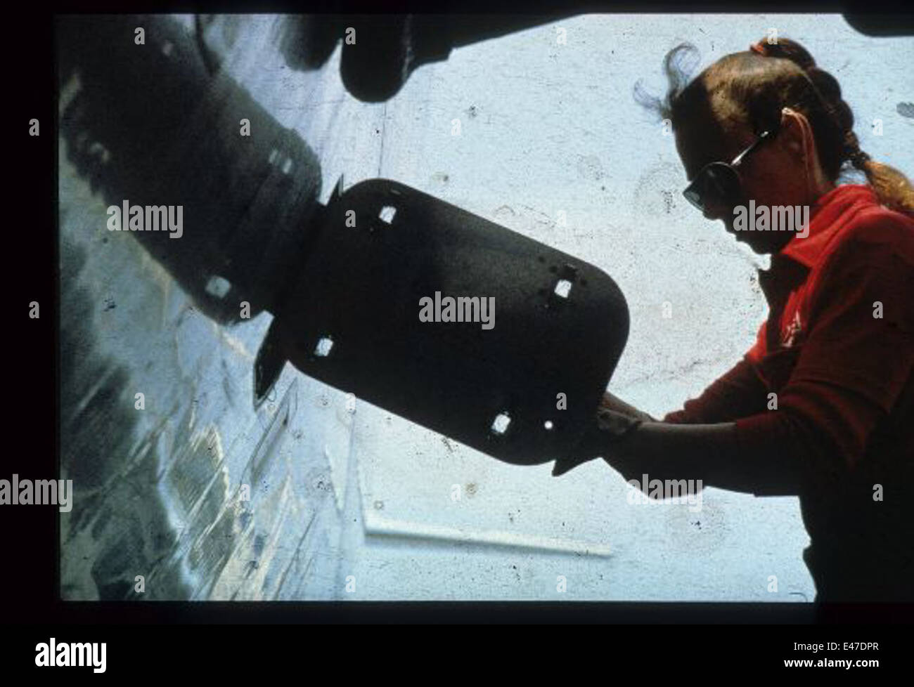 This image, cataloged as 07.05.B1-0023, depicts a flight attendant from ...