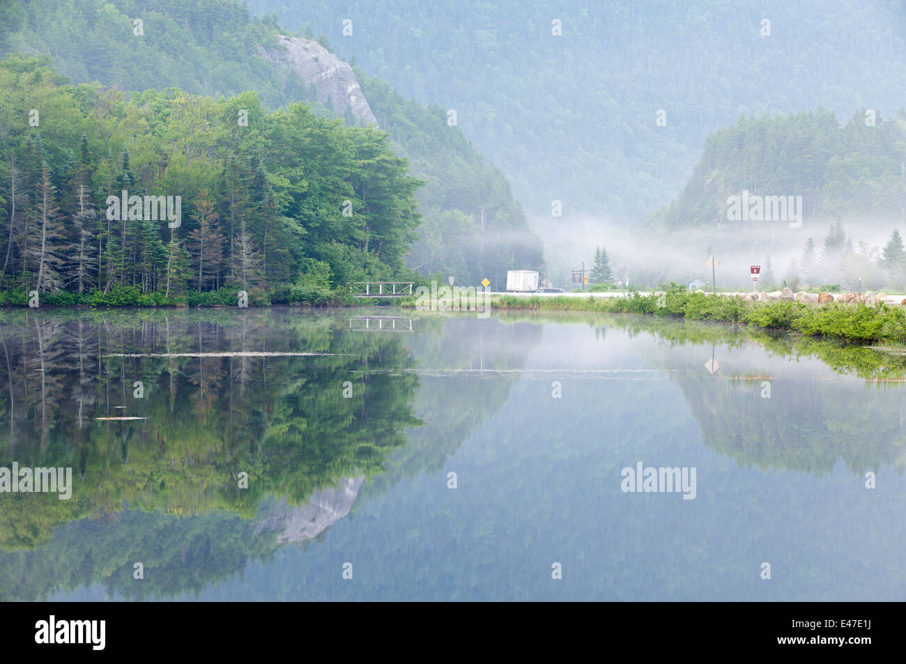 Reflection of Elephant Head rock profile in Saco Lake at the start of ...