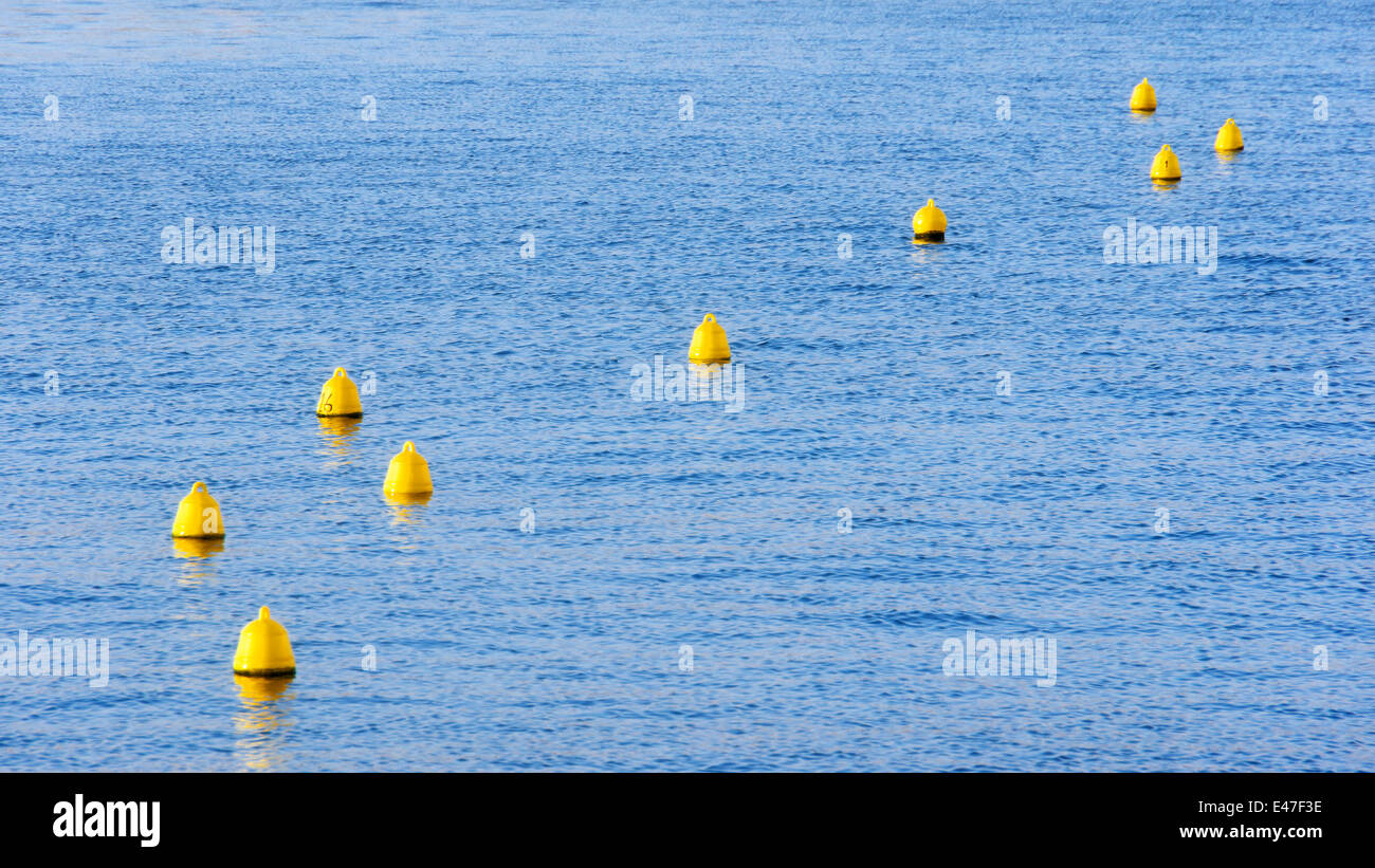 yellow buoys floating on water Stock Photo - Alamy
