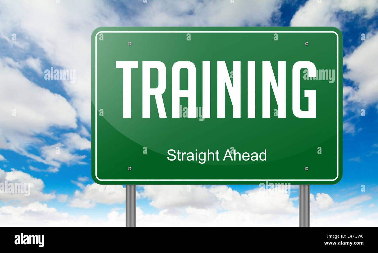 Training on Green Highway Signpost Stock Photo - Alamy
