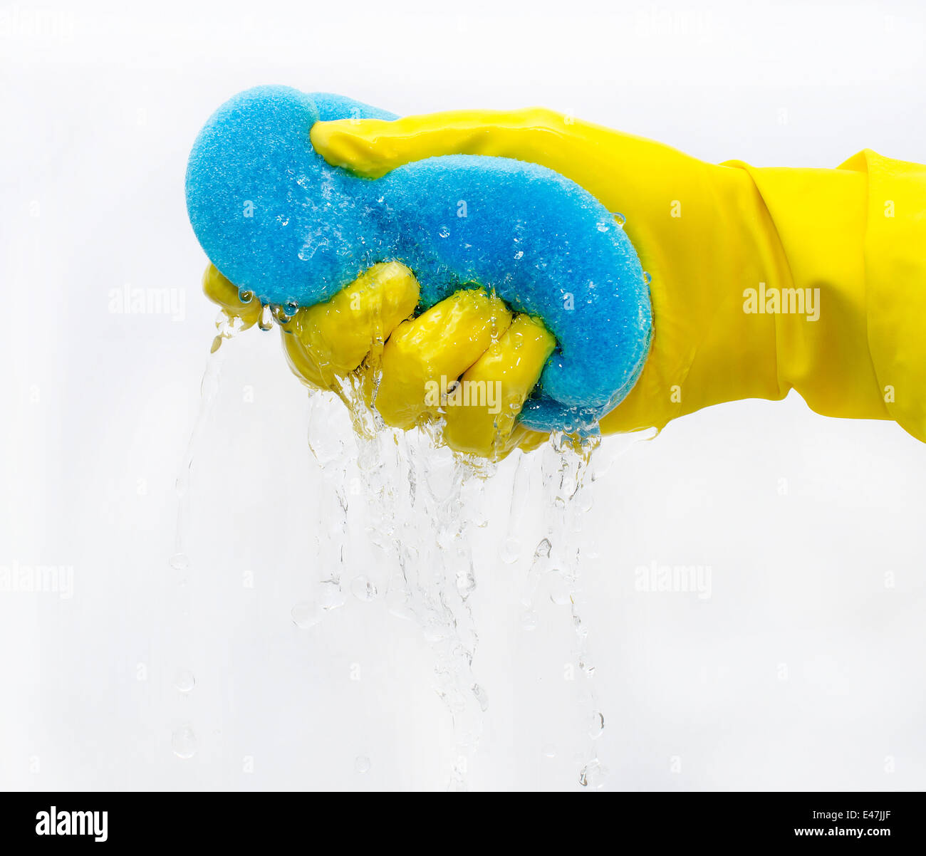 yellow cleaning gloves with blue sponge on white backgound Stock Photo ...