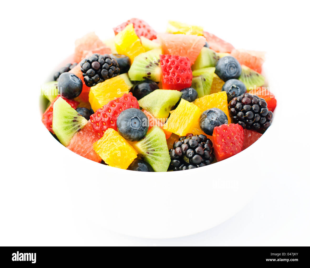 Fresh fruit salad mix in white bowl Stock Photo - Alamy