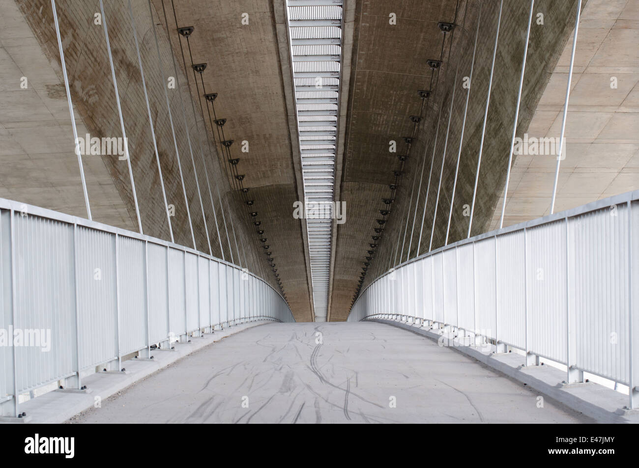 New suspended footbridge under a concrete bridge Stock Photo - Alamy