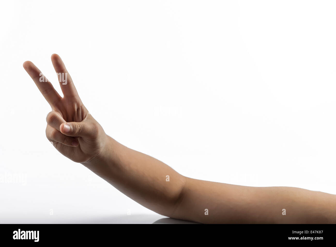 Young hands makes a gesture: victory sign with two fingers Stock Photo ...