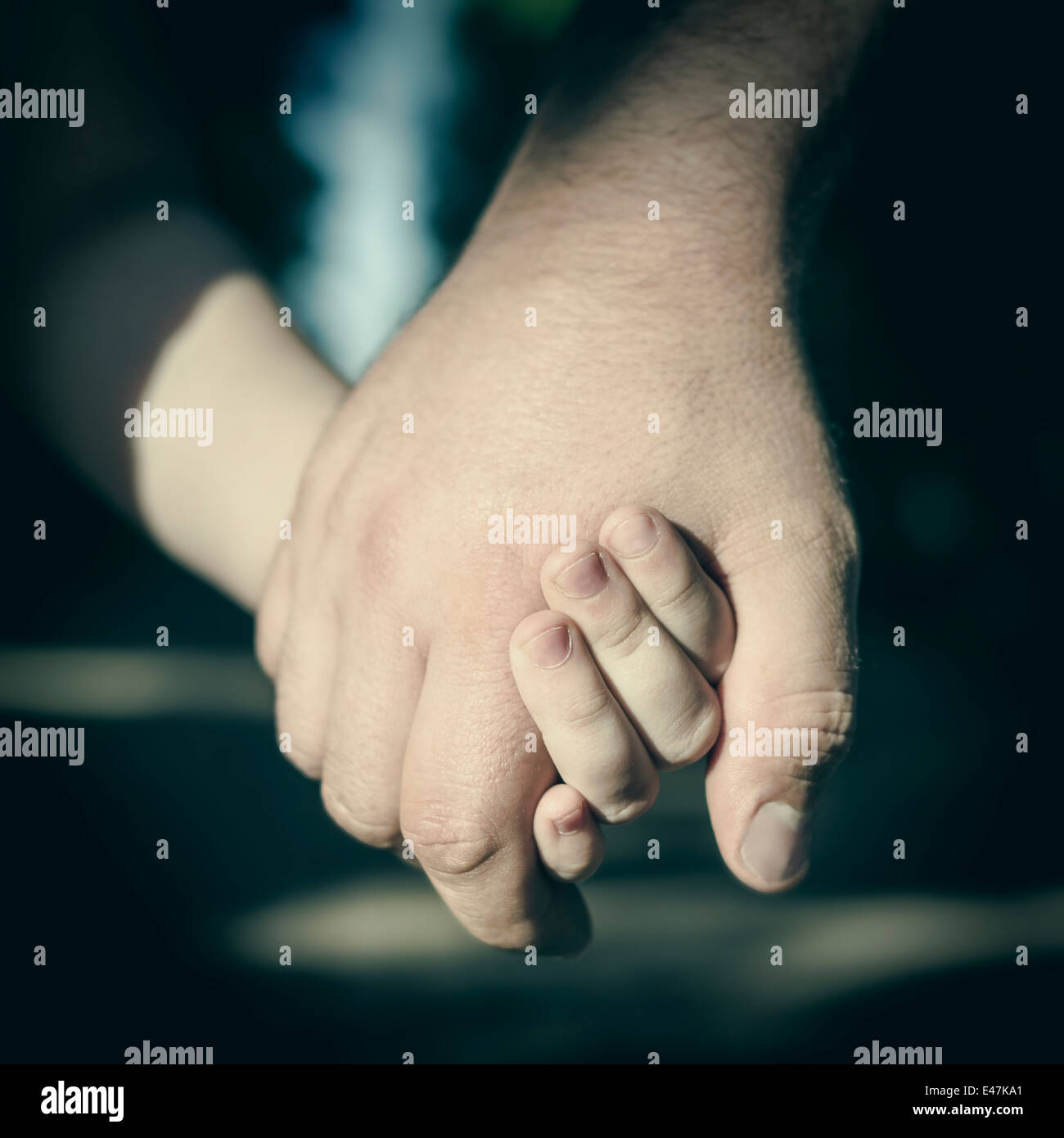 Child holding father's hand Stock Photo - Alamy