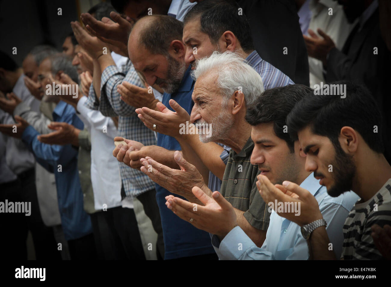 Tehran, Iran. 4th July, 2014. Iranian Muslims pray during Islamic holy ...