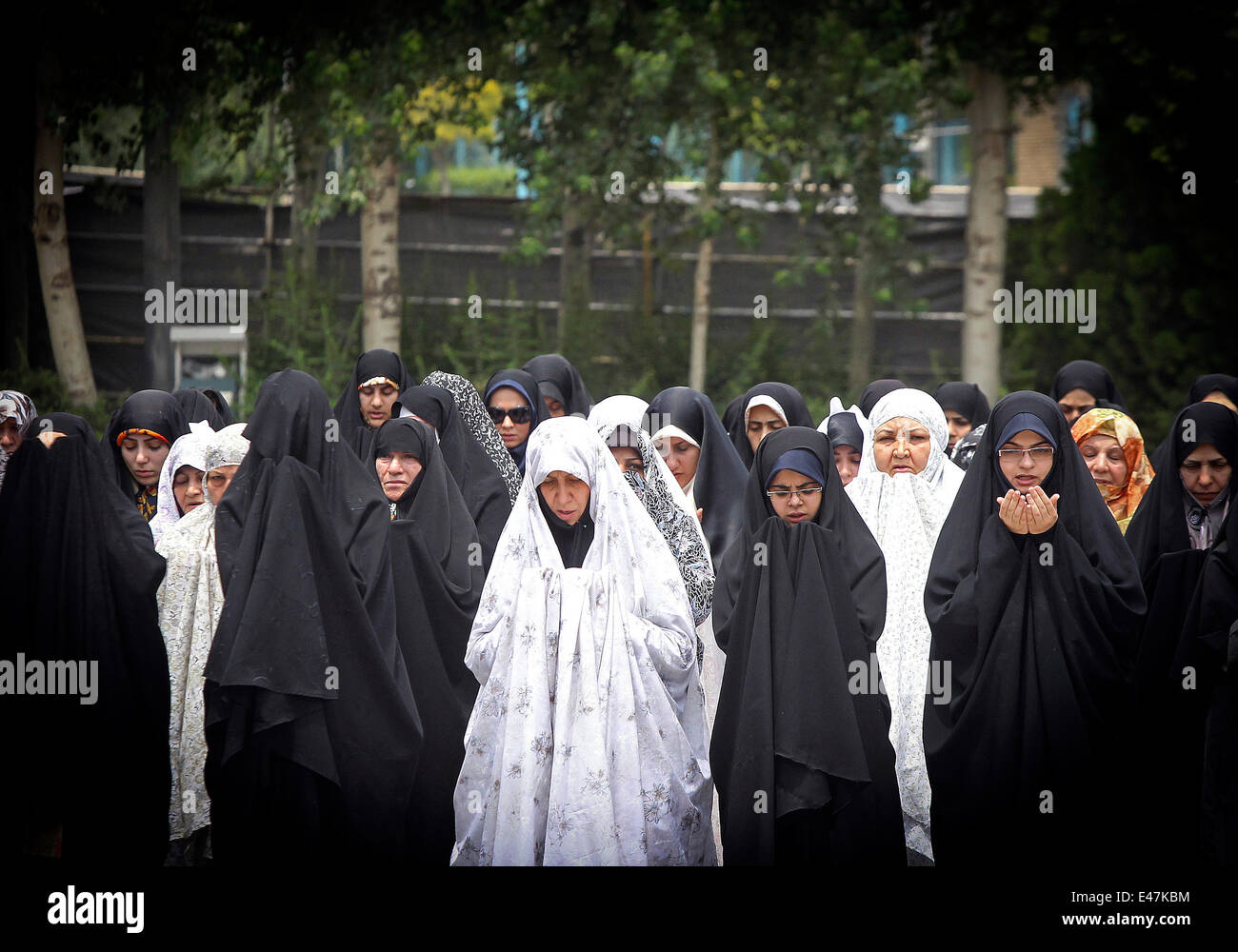 Tehran, Iran. 4th July, 2014. Iranian Muslims pray during Islamic holy ...