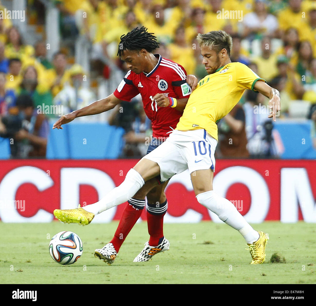 Fortaleza, Brazil. 4th July, 2014. Brazil's Neymar vies with Colombia's Juan Guillermo Cuadrado ...