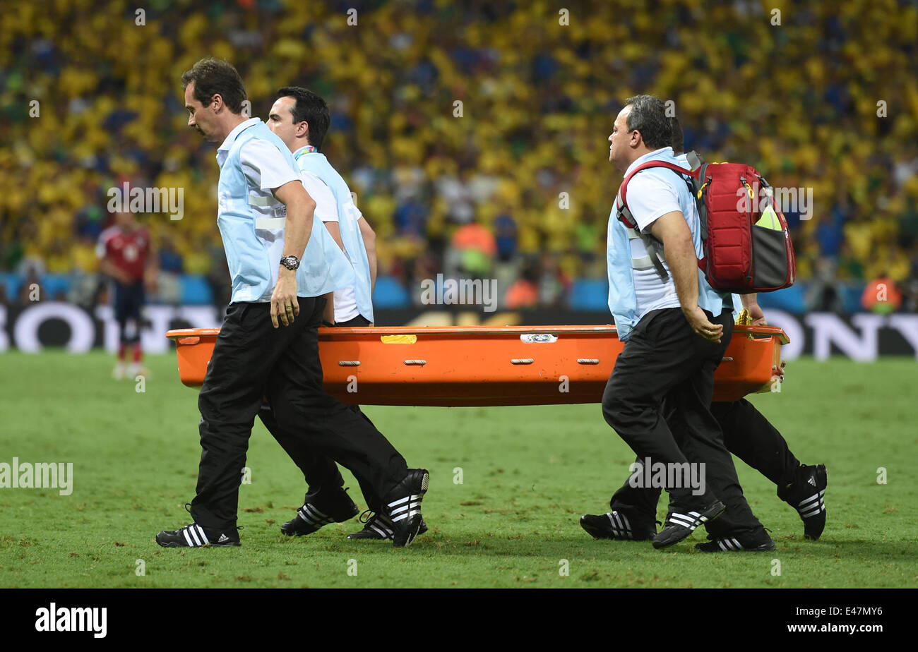 Fortaleza, Brazil. 04th July, 2014. Neymar of Brazil is taken from the pitch on a stretcher ...