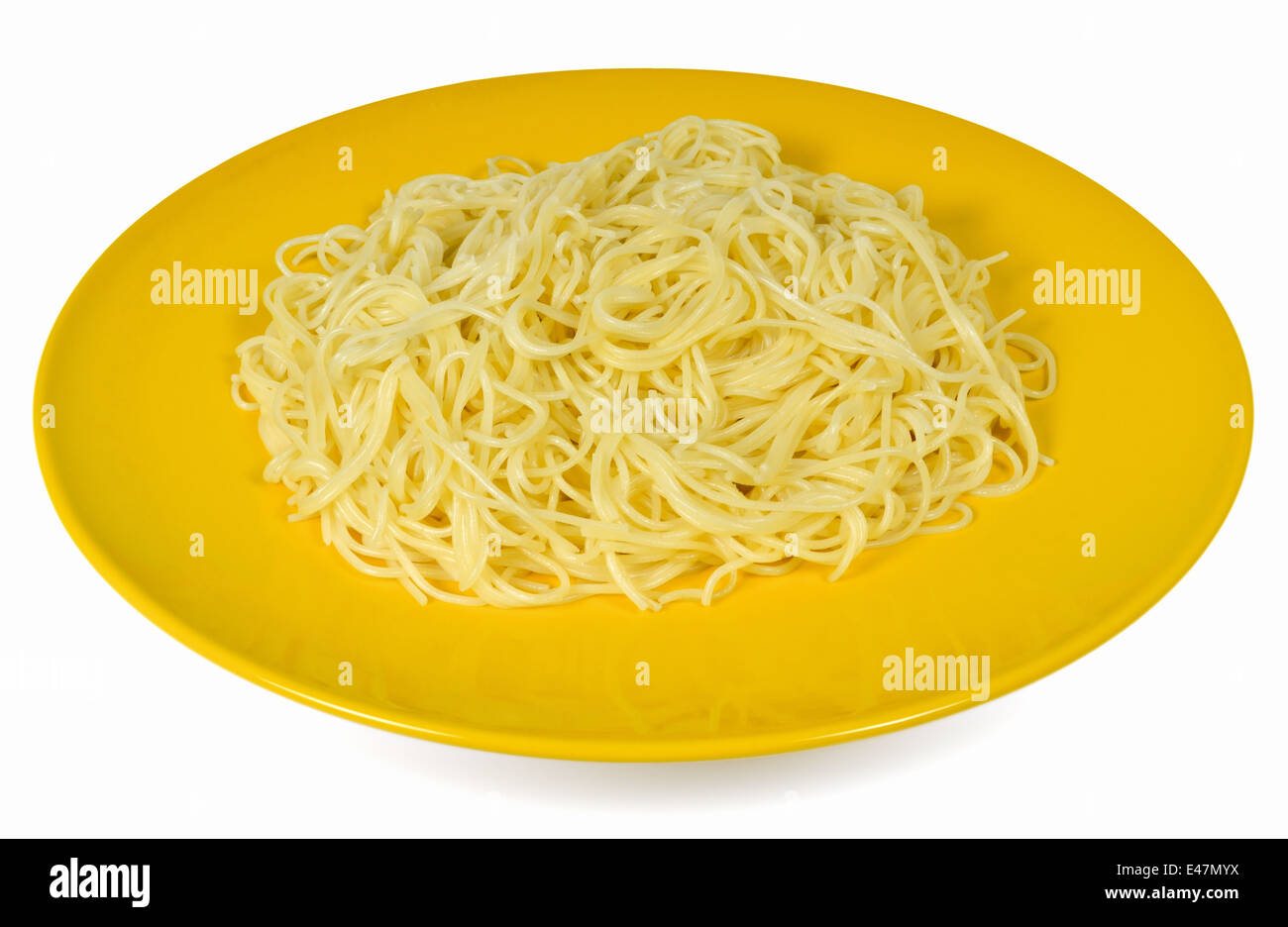 Boiled spaghetti served in a big yellow plate isolated on white ...