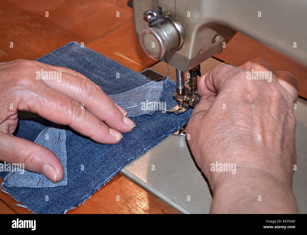 Hand sewing with a sewing machine Stock Photo - Alamy