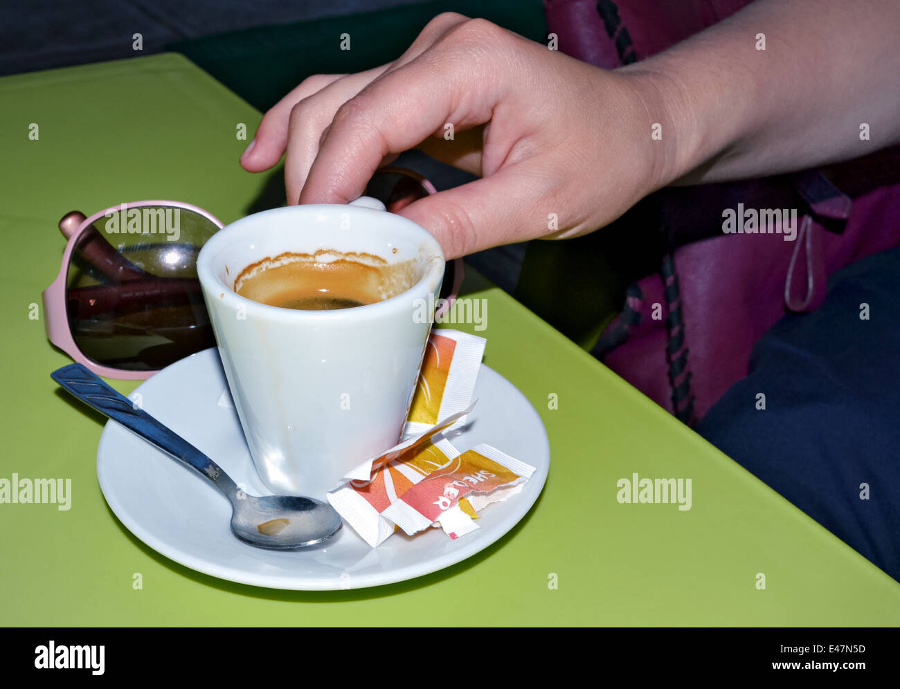 Relaxing with a cup of espresso in cafeteria Stock Photo - Alamy