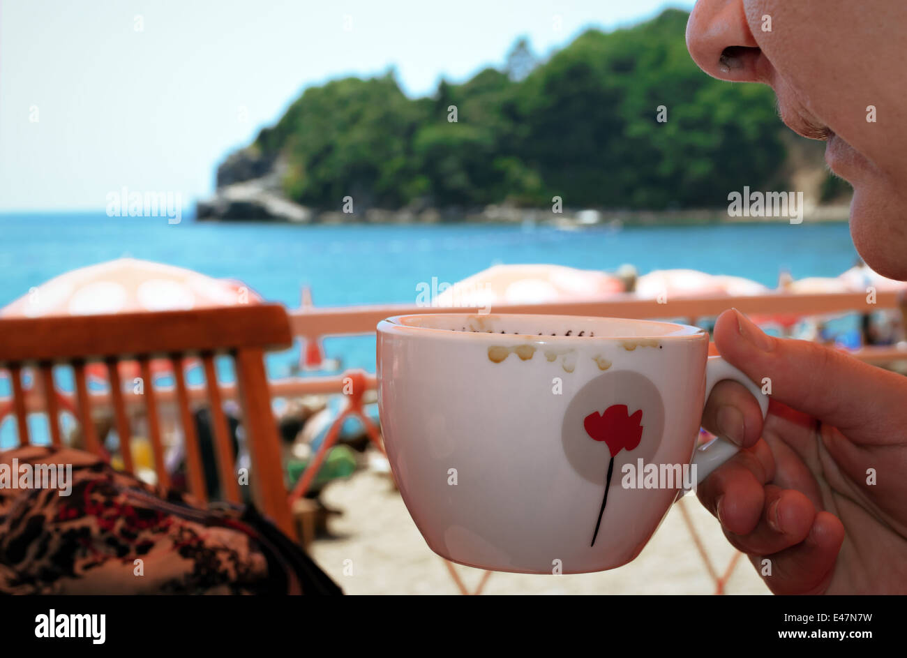 Enjoying cup of coffee on a beach Stock Photo - Alamy