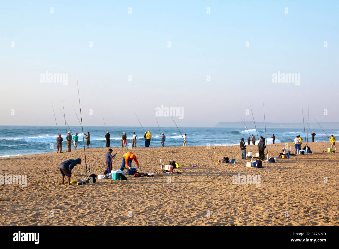 DURBAN, SOUTH AFRICA - JULY 2, 2014: Many unknown fishermen fish on ...