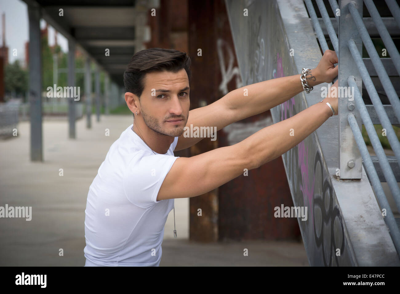 Handsome man outdoor in urban environment looking at camera Stock Photo ...