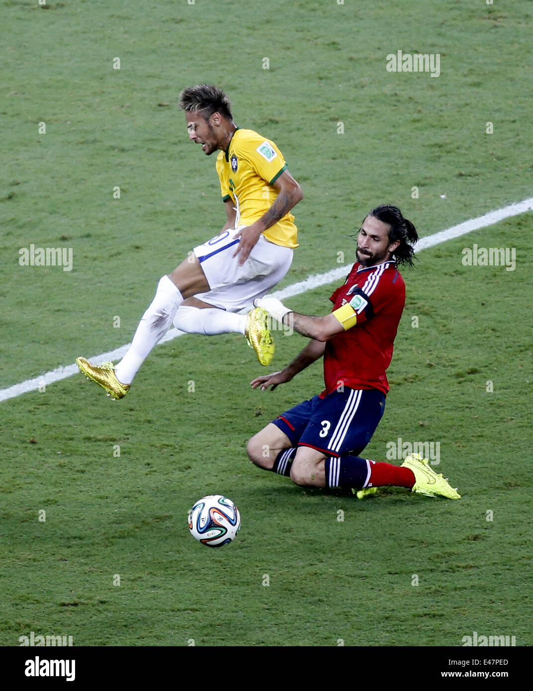 Fortaleza, Brazil. 4th July, 2014. Brazil's Neymar (L) vies with Colombia's Mario Yepes during a ...