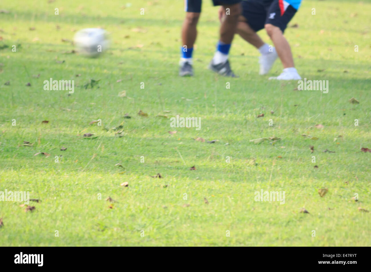 People playing football Stock Photo - Alamy