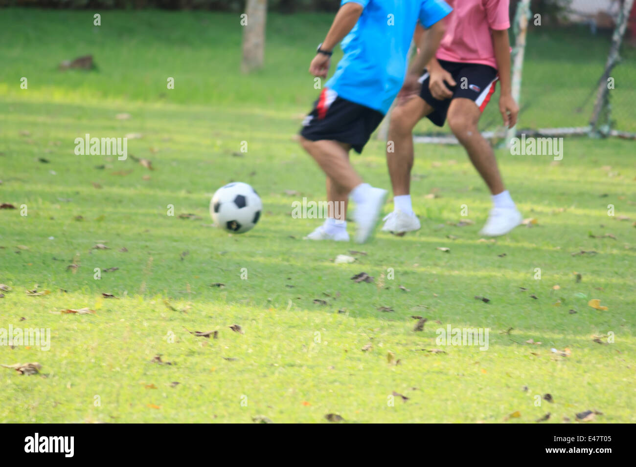 People playing football Stock Photo - Alamy