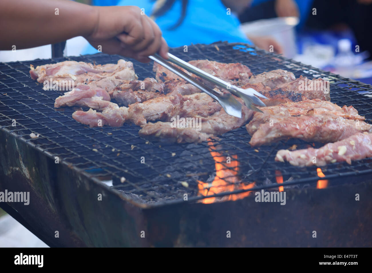 People are grilling pork on the stove Stock Photo - Alamy