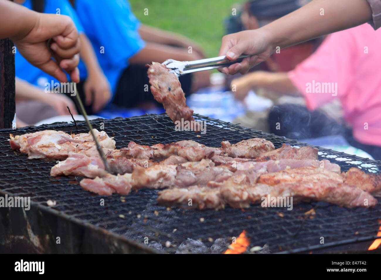 People are grilling pork on the stove Stock Photo - Alamy