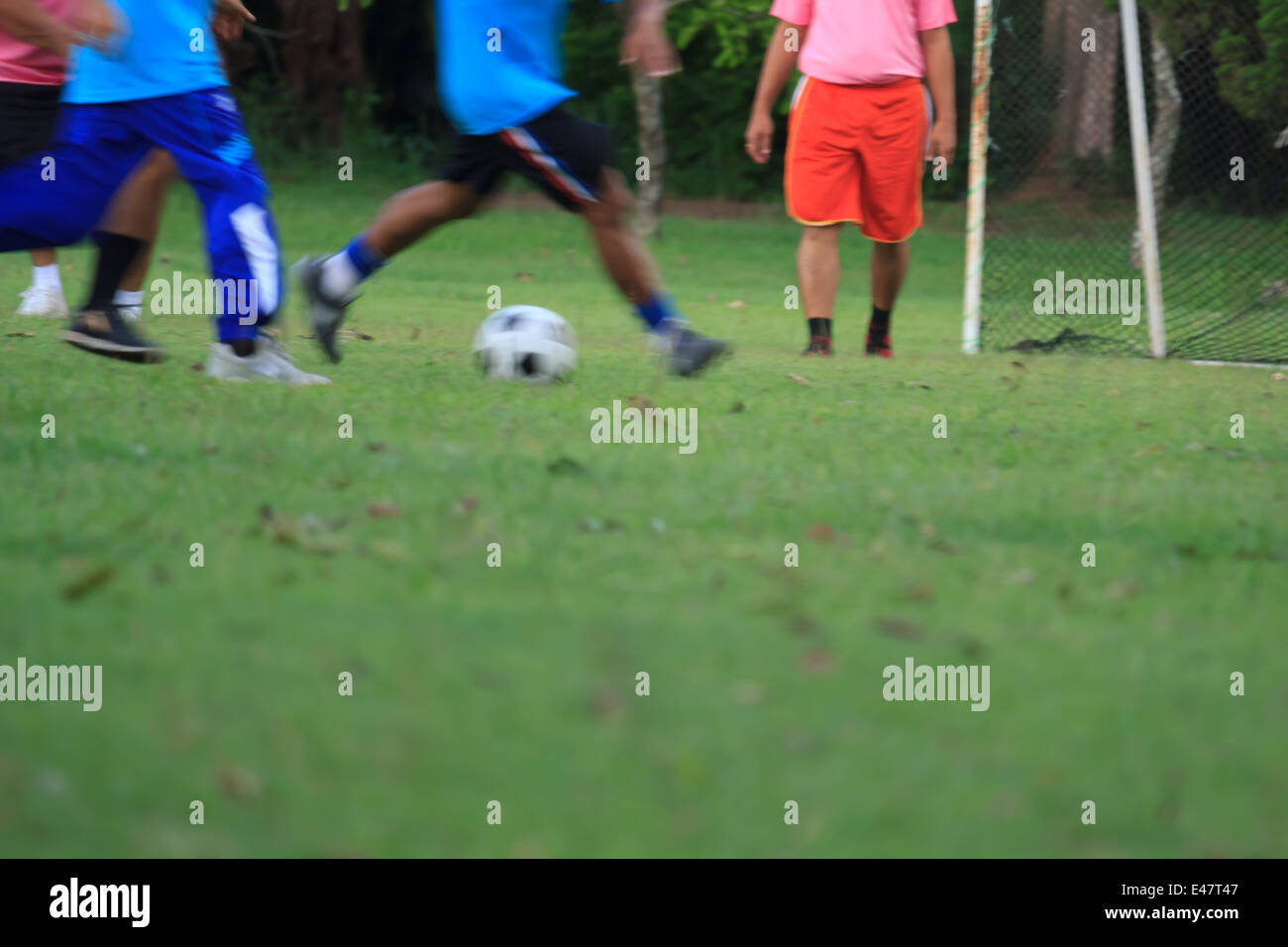 People playing football Stock Photo - Alamy