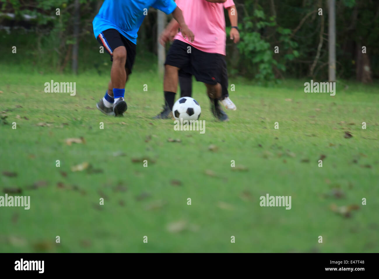 People playing football Stock Photo - Alamy