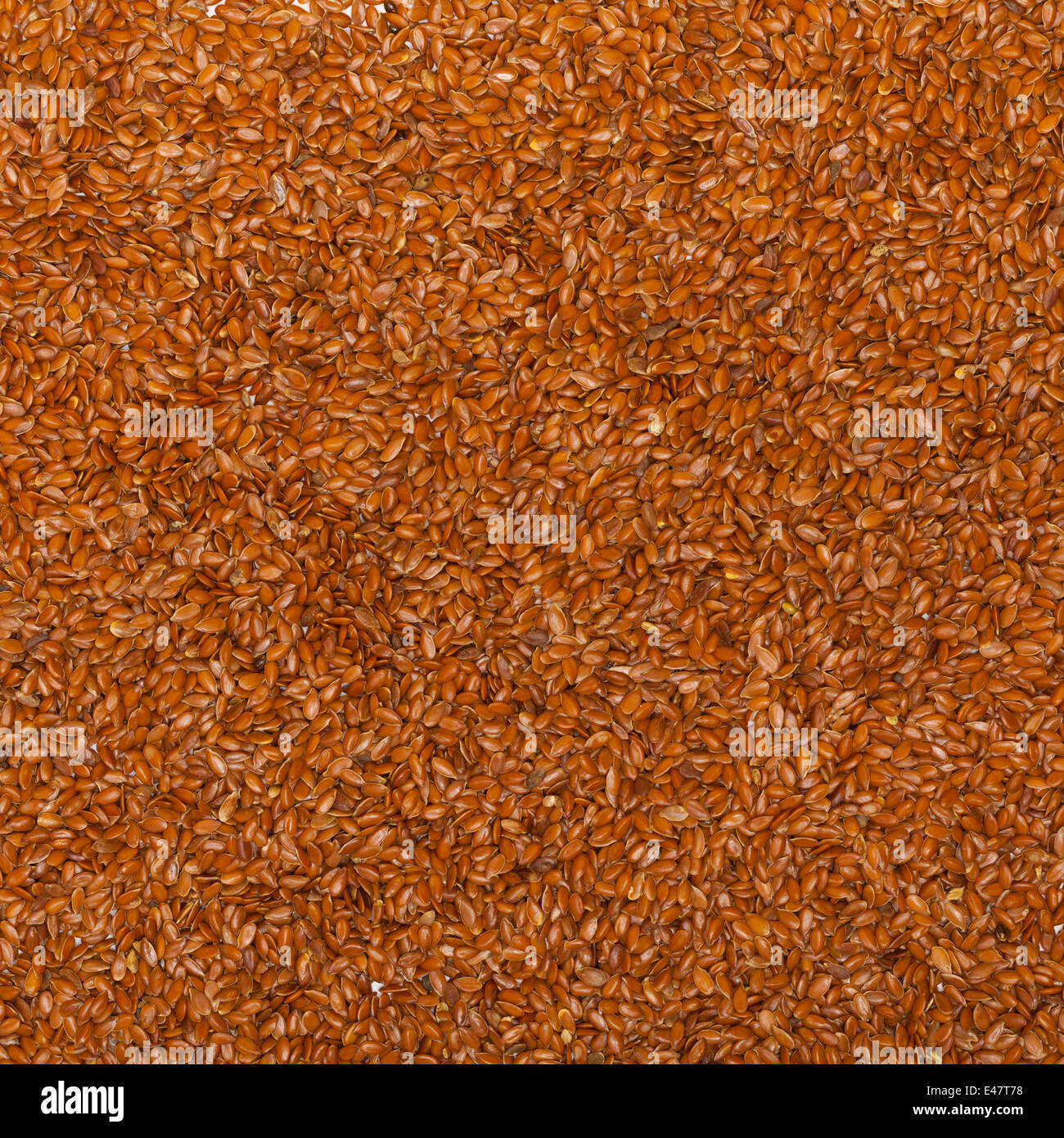 Close up of flaxseed linseed as brown red food background or grain ...