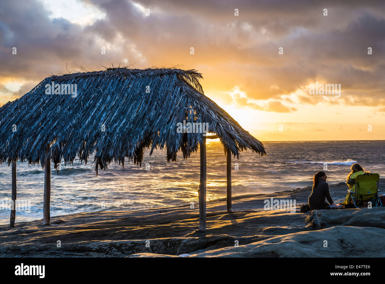The Sun settting with the Surf Shack in the foreground. Windansea Beach ...