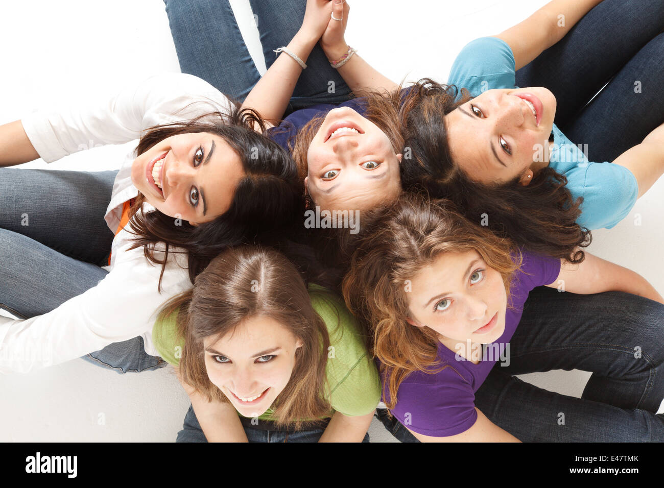 a group of five girls having fun hanging out making a circle Stock ...
