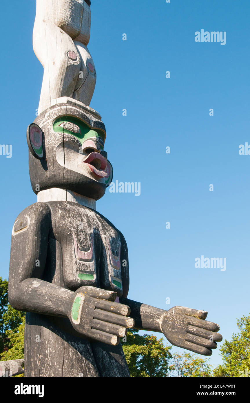 First Nation native totem story monument pole in cemetery in Alert Bay ...