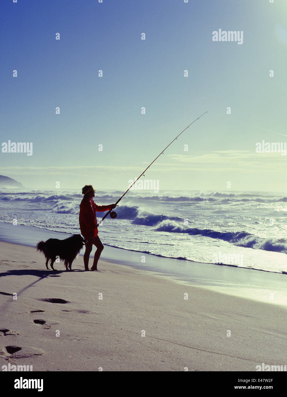 Woman fishing off beach hi-res stock photography and images - Alamy