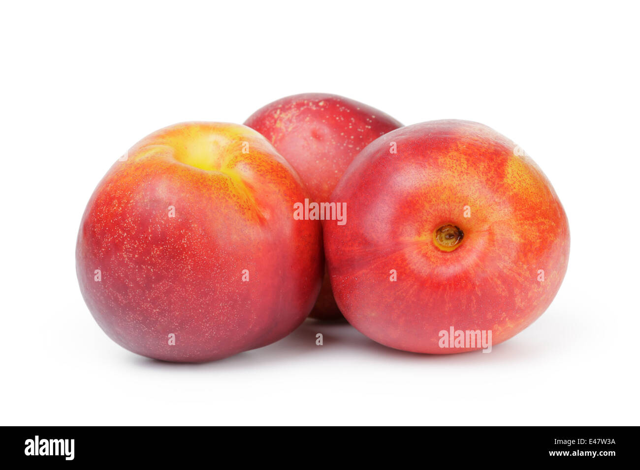 three ripe whole nectarines, isolated on white background Stock Photo ...