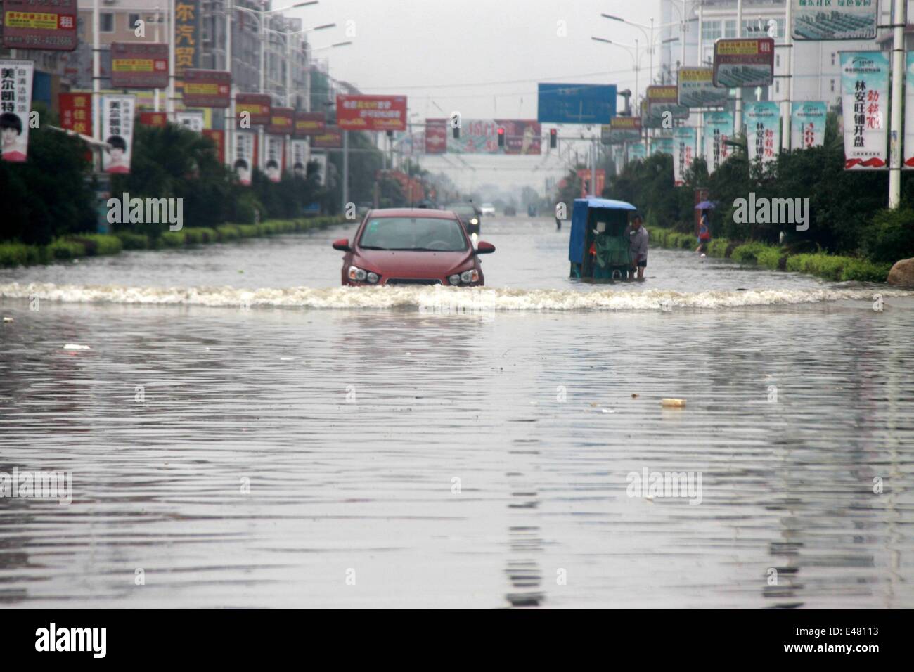 Jiujiang, China's Jiangxi Province. 5th July, 2014. A vehicle runs on ...