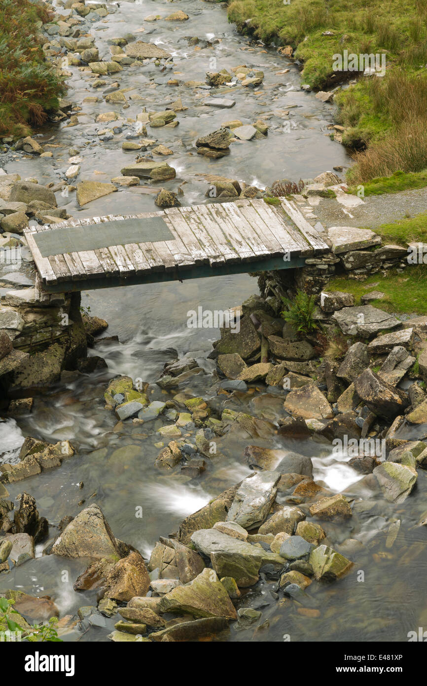 Wooden plank topped bridge, crossing mountain stream. Cwmorthin ...