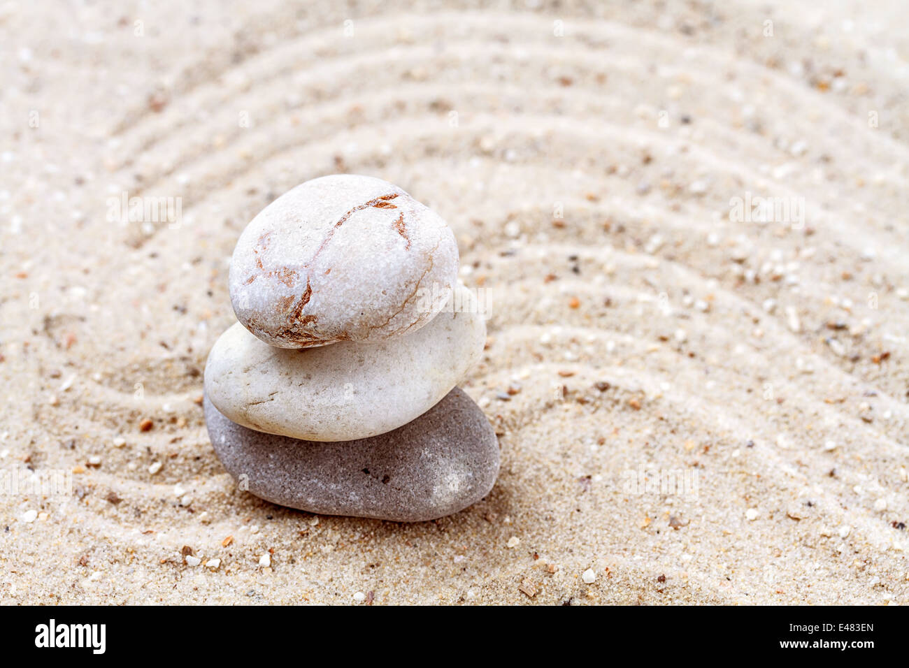 Stack of zen stones on sand beach Stock Photo - Alamy