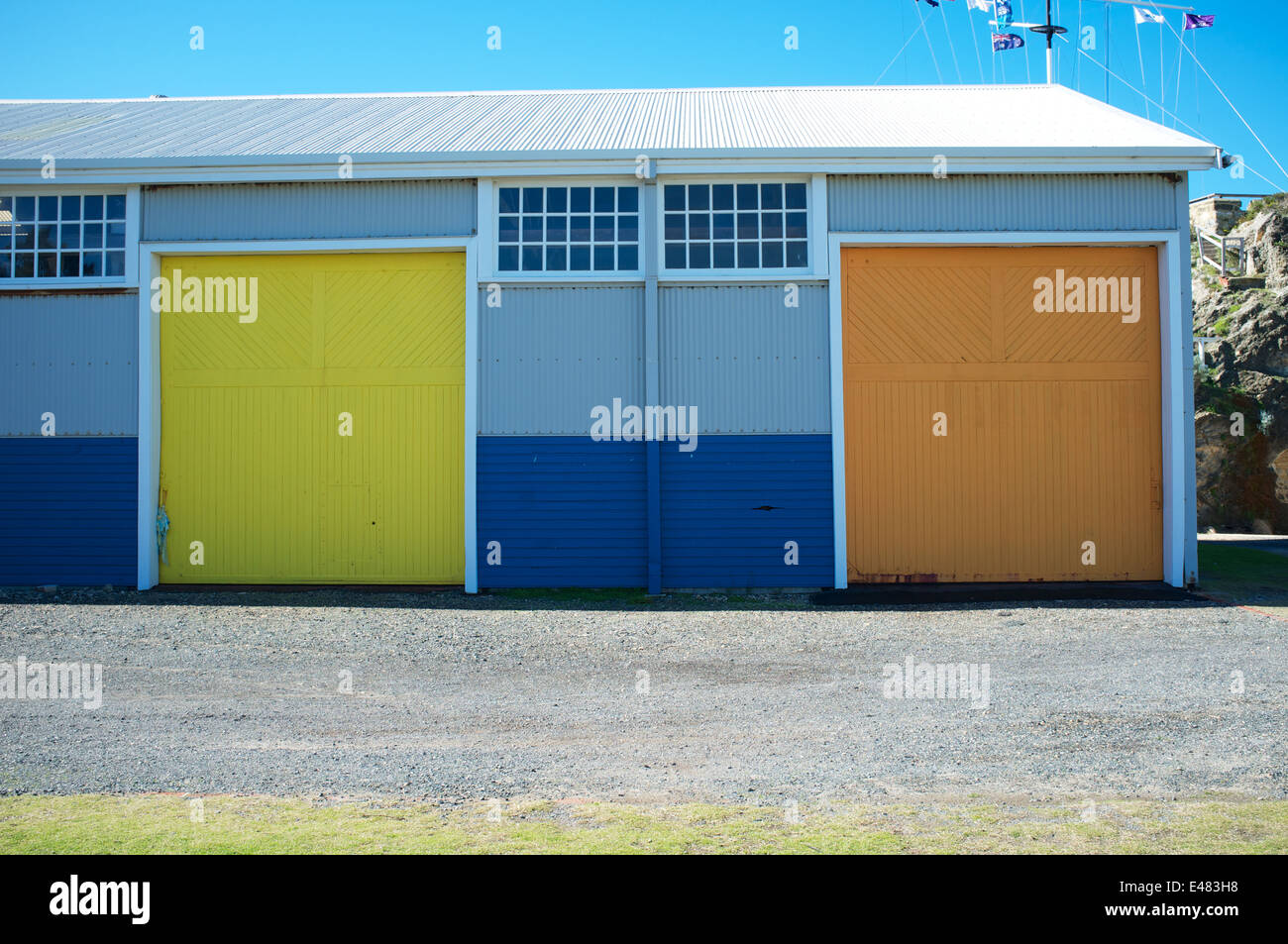 Orange and yellow doors on a blue painted warehouse in Fremantle ...