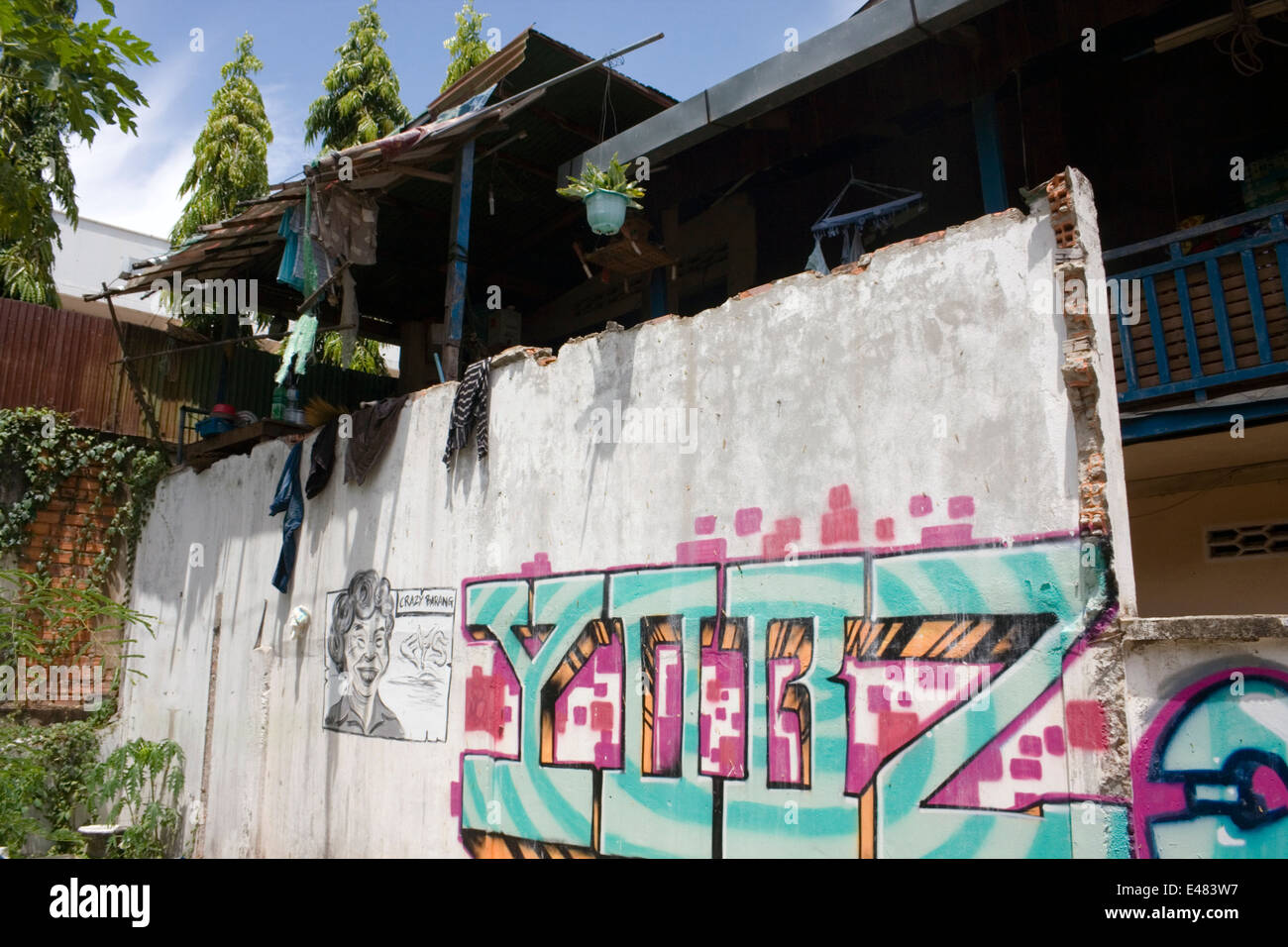 A wall is painted with graffiti in an eviction zone near Boeung Kak ...