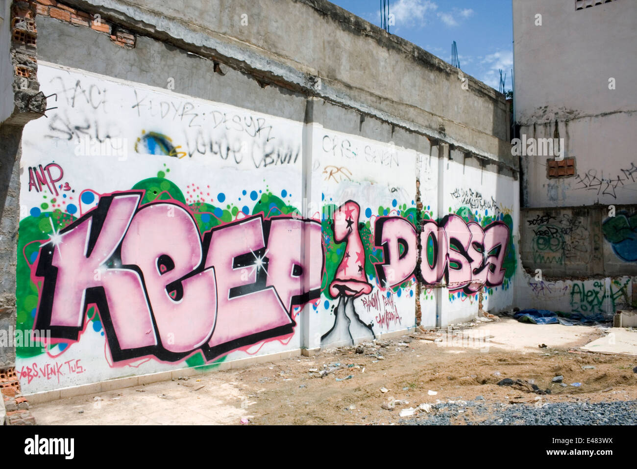 A wall is painted with graffiti in an eviction zone near Boeung Kak ...