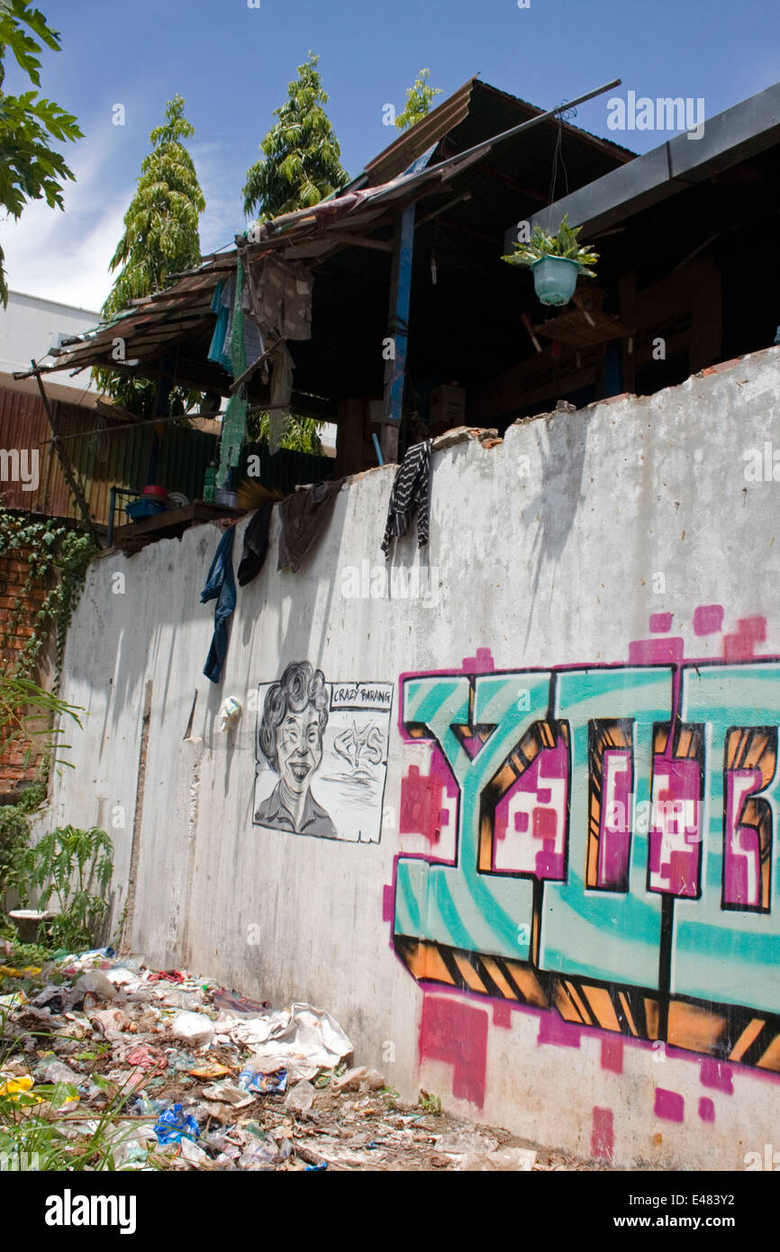 A wall is painted with graffiti in an eviction zone near Boeung Kak ...