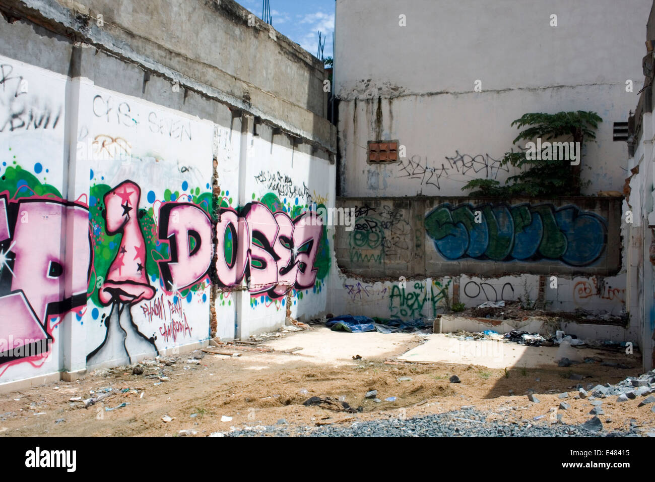 A wall is painted with graffiti in an eviction zone near Boeung Kak ...