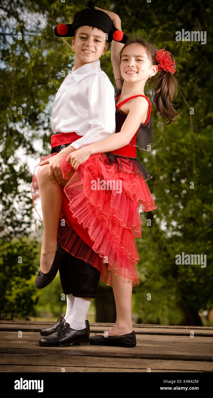 Lovely young couple dancing and having fun on a bridge. More images ...