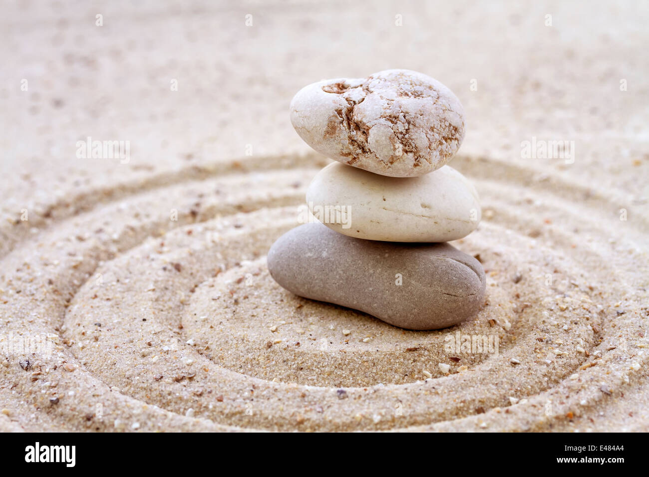 Stack of zen stones on sand beach Stock Photo - Alamy
