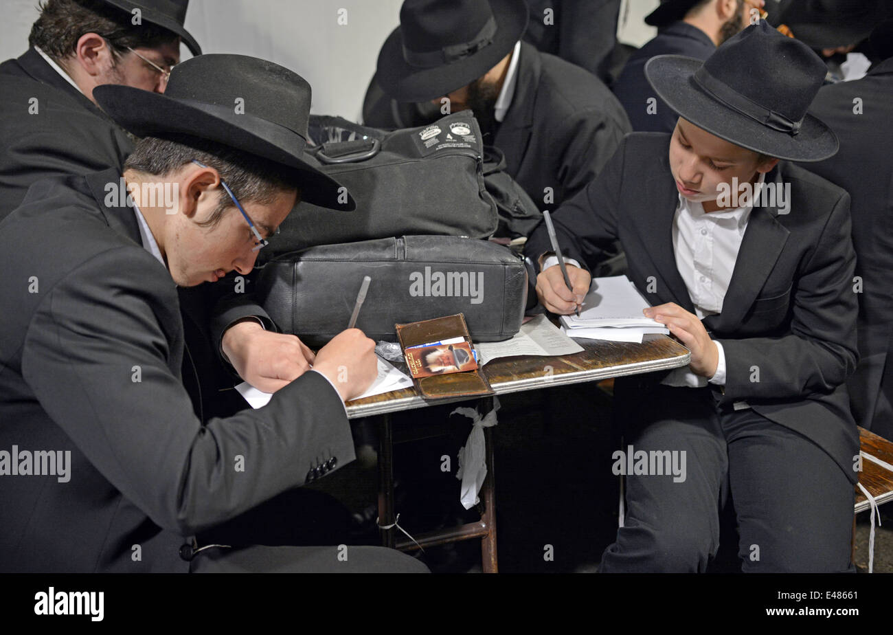 Religious jewish young men writing hi-res stock photography and images ...