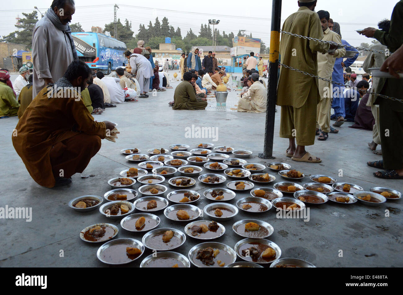 Quetta. 5th July, 2014. Men prepare Iftar food for Muslim devotees ...