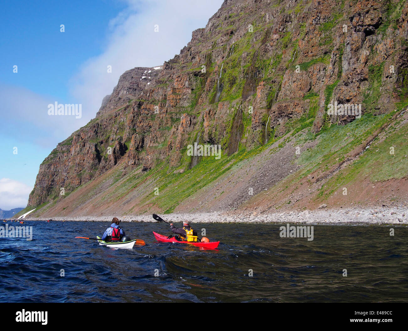 sea kayaking below cliffs, Snaefjallaströnd, west fjords, Iceland Stock ...