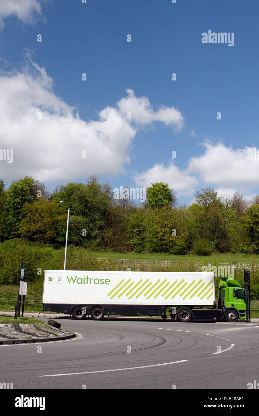 A Waitrose truck exiting a roundabout in Coulsdon, Surrey, England ...