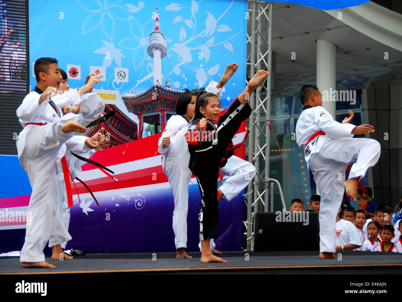 BANGKOK, THAILAND: Youngsters performing a Tae Kwan Do routine at a ...