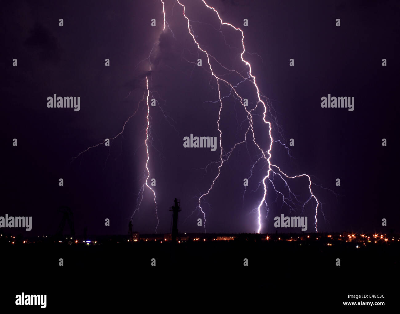lightning at night over city Stock Photo - Alamy
