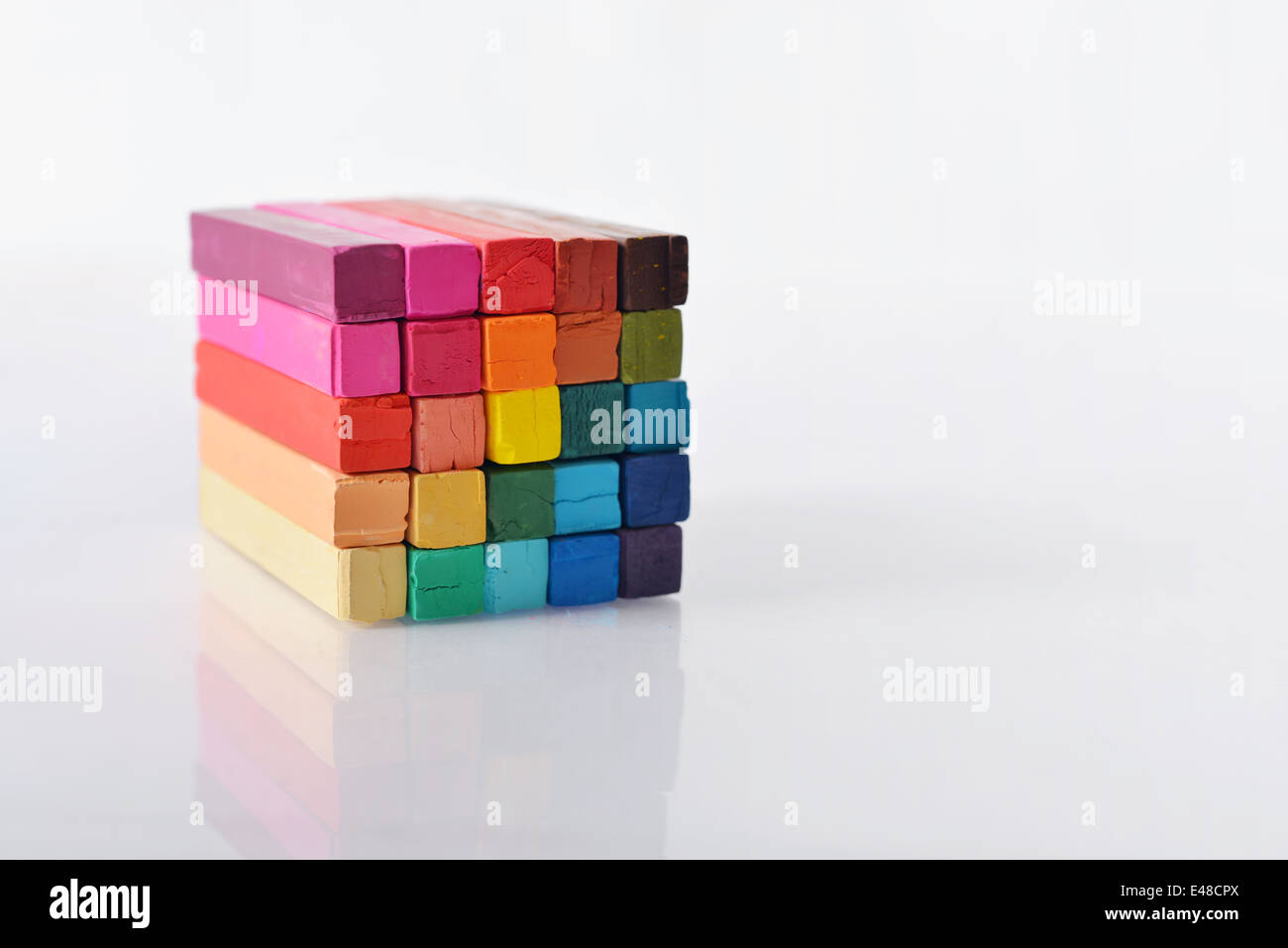 The cube from multicolored artist's pastels on light background Stock ...